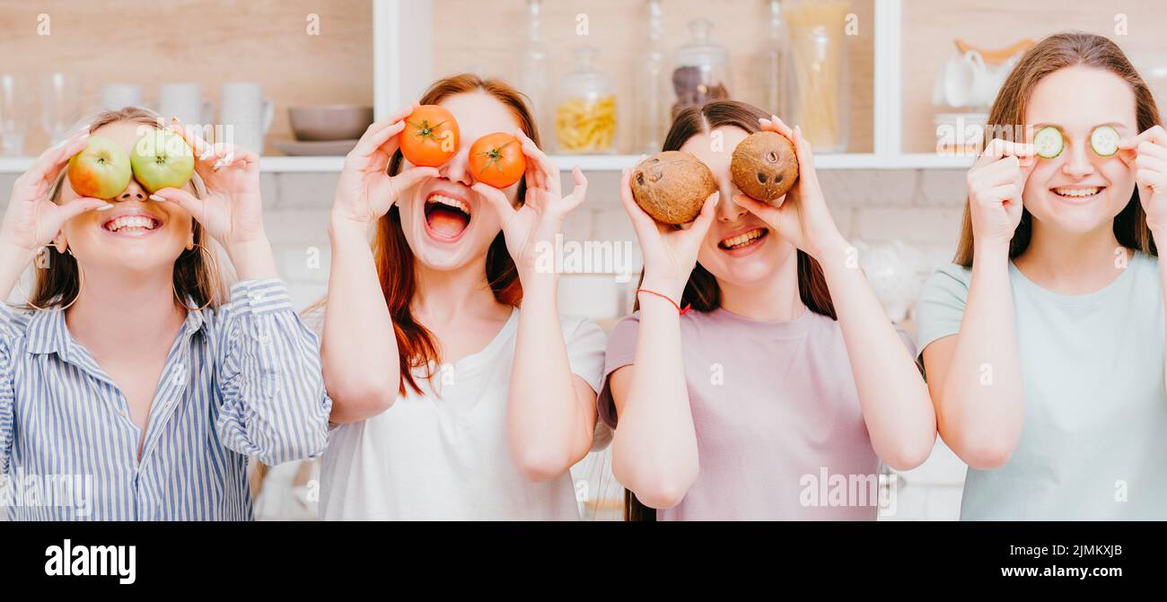 healthy lifestyle happy female friends fun kitchen Stock Photo - Alamy