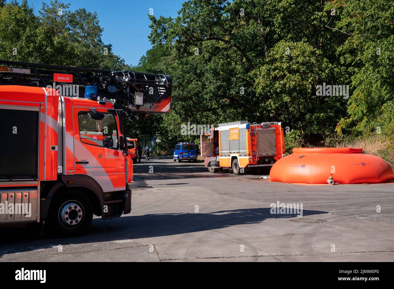 Berlin, Germany. 07th Aug, 2022. Fire engines and police vehicles stand ...