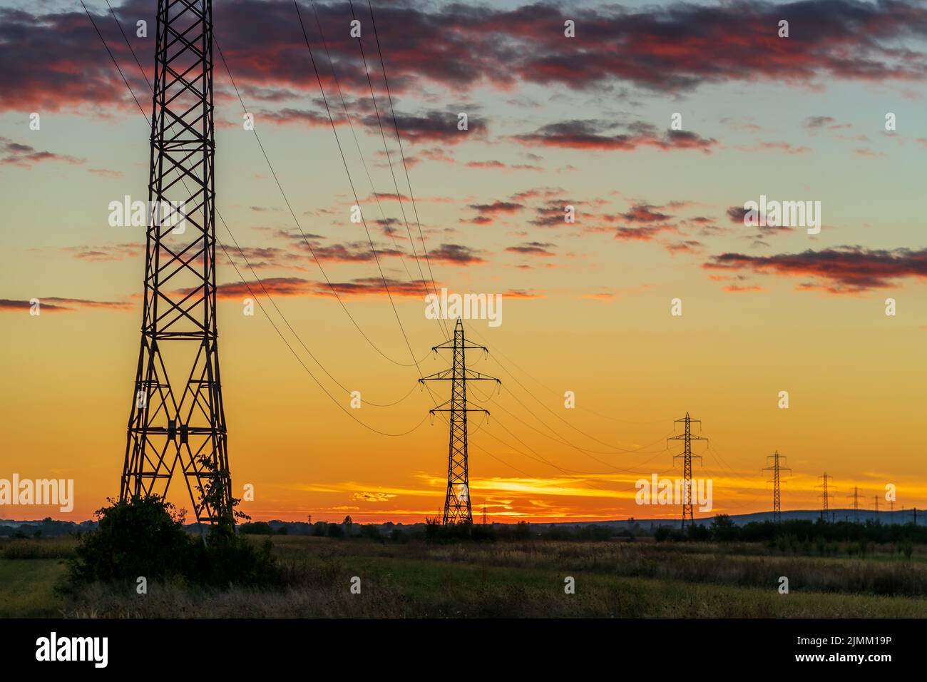 Detail of electric pole with electric cables at sunset Stock Photo - Alamy