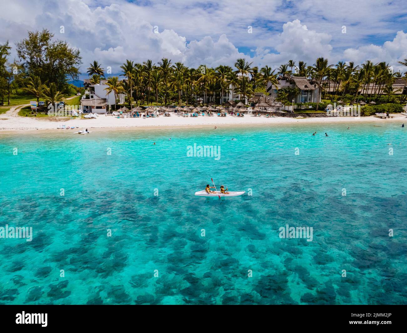 Mauritius vacation, couple man and woman in kayak in a bleu ocean in ...