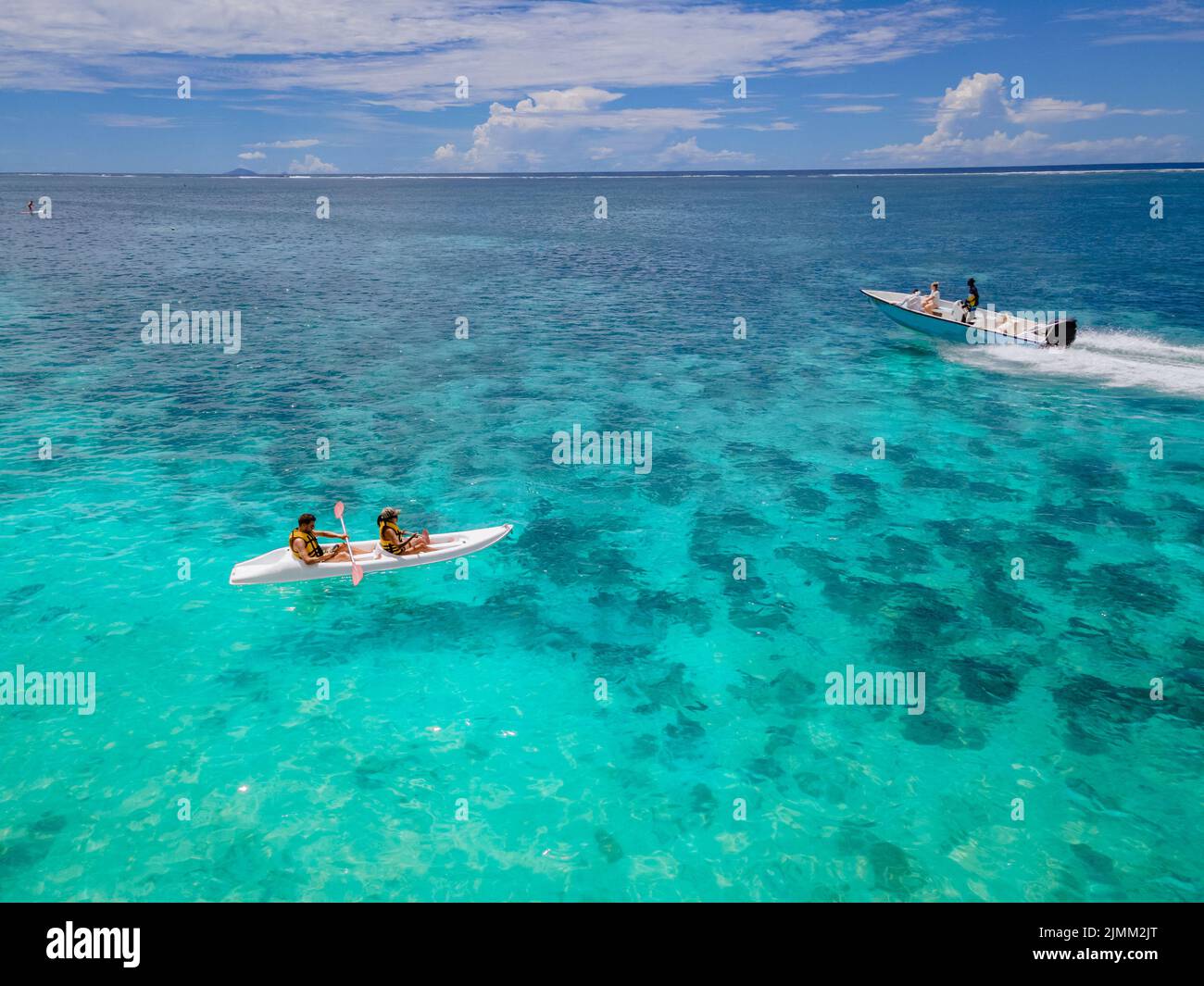 Mauritius vacation, couple man and woman in kayak in a bleu ocean in ...