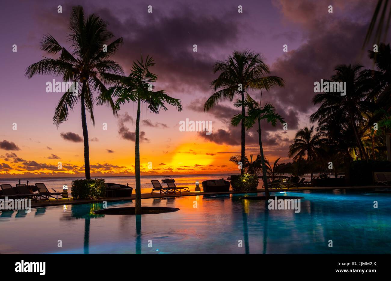 Sunset tropical pool with palm trees, sunset by the pool with palm ...