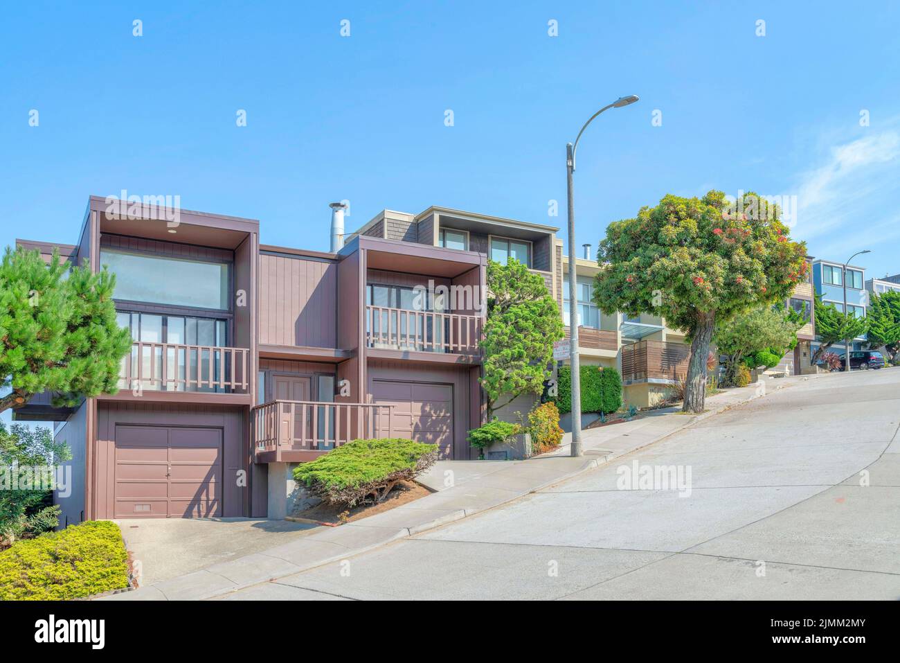 Modern house building with flat roofs on a sloped area at San Francisco ...