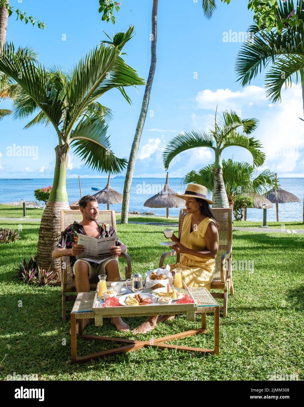 Breakfast at a beach with palm trees and pool in Mauritius, tropical ...