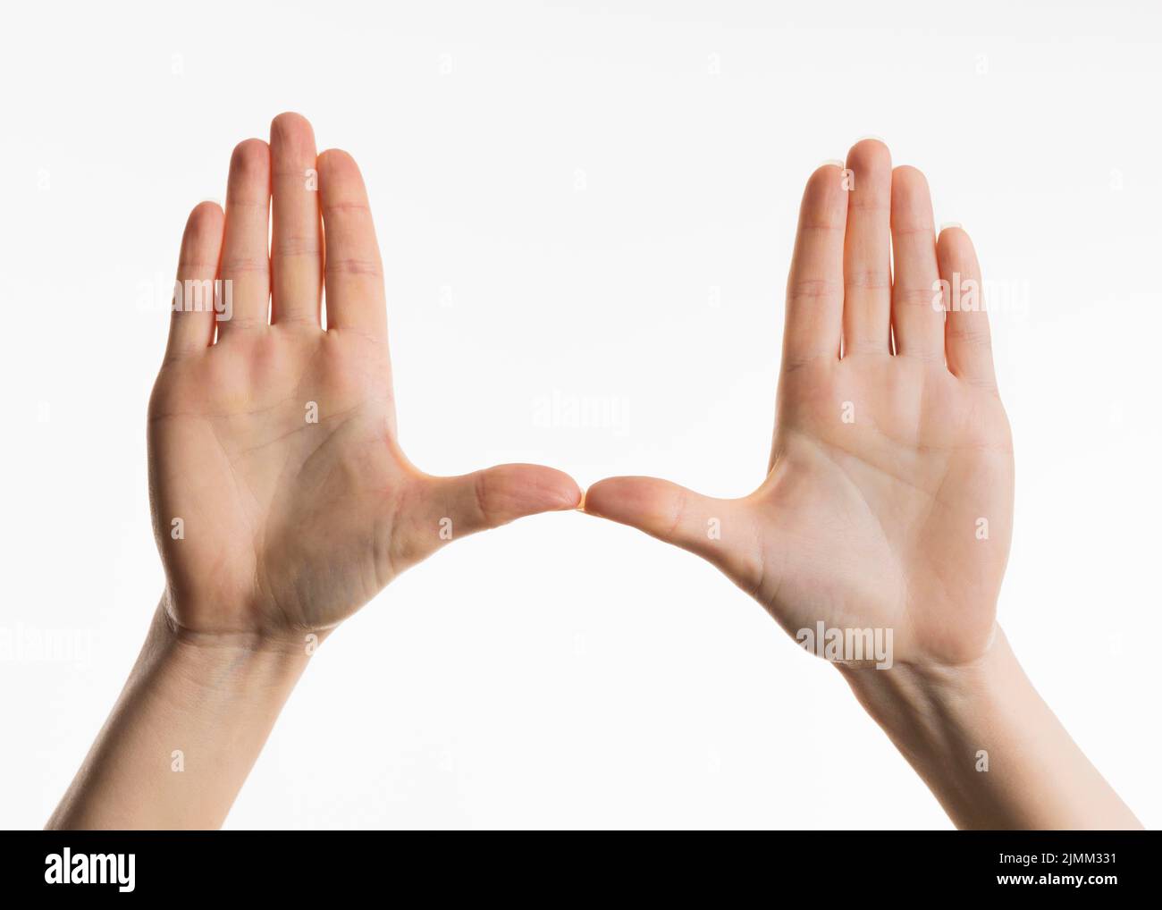 Front view hands showing palms Stock Photo - Alamy