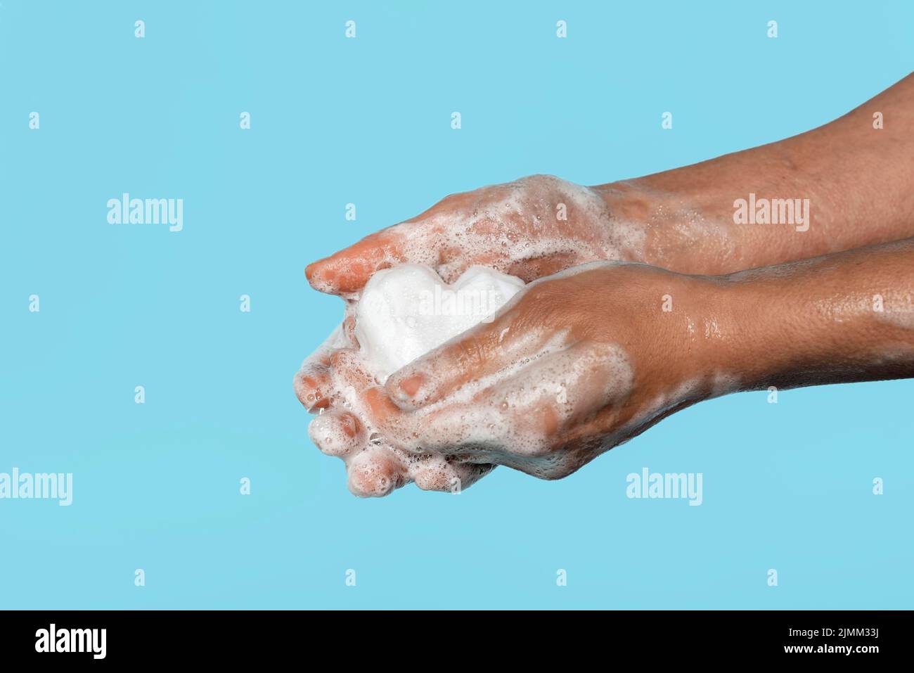 Sideways person washing hands with white soap Stock Photo - Alamy
