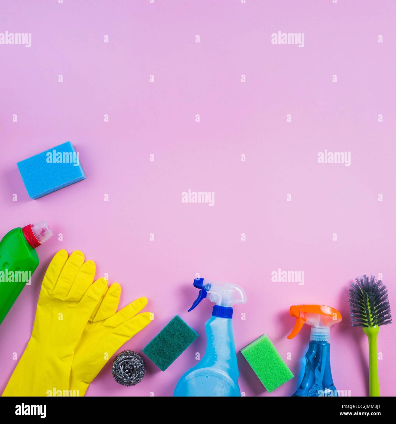 Elevated view cleaning products pink background Stock Photo - Alamy