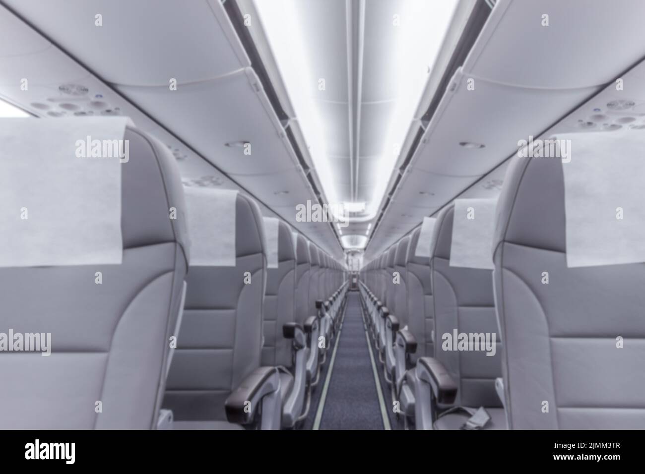 Perspective view of empty aircraft seats and lights Stock Photo - Alamy