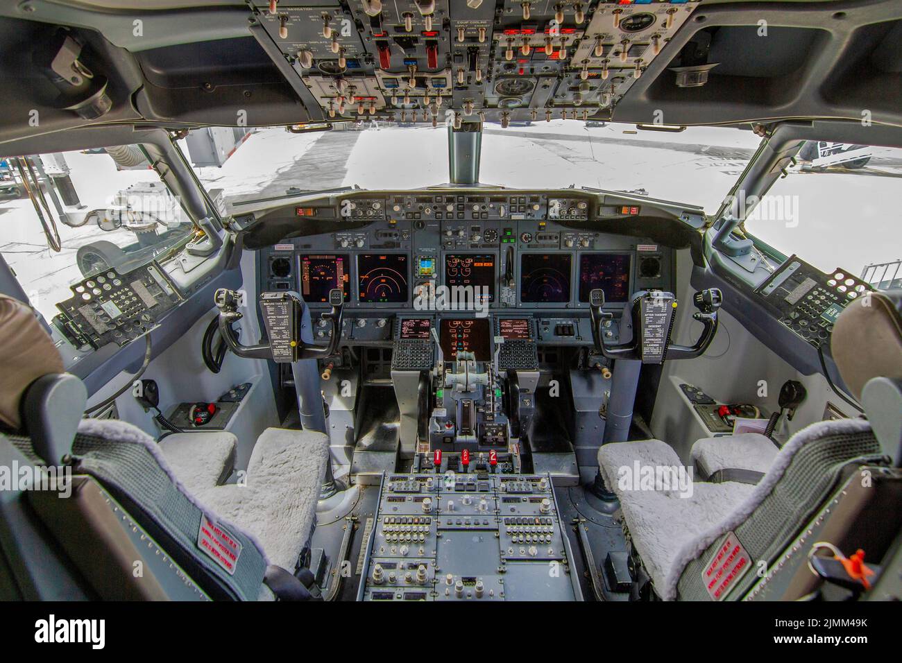 A view of the cockpit of a large commercial airplane a cockpit ...