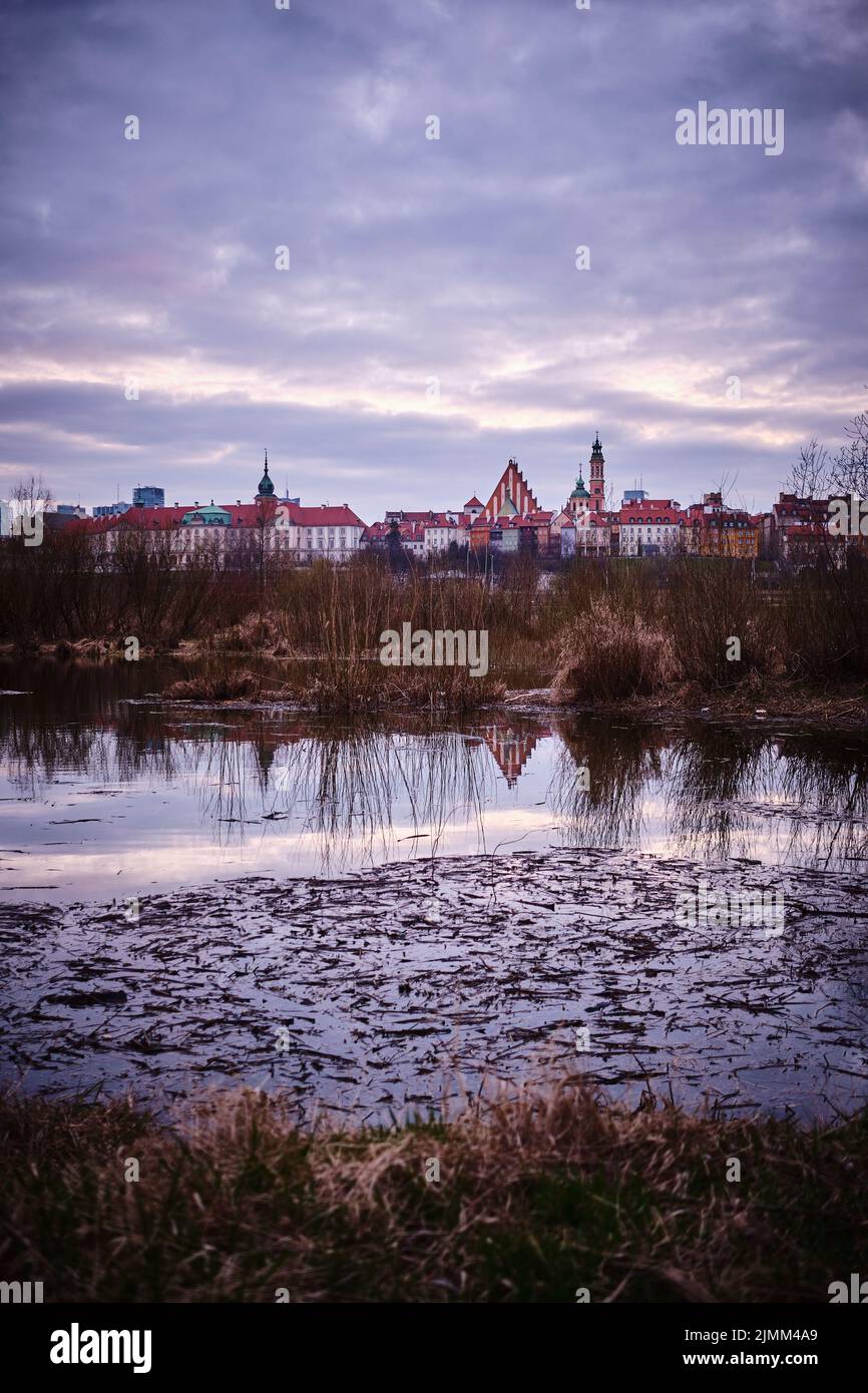 A vertical shot of the Warsaw city reflecting on the lake Stock Photo ...