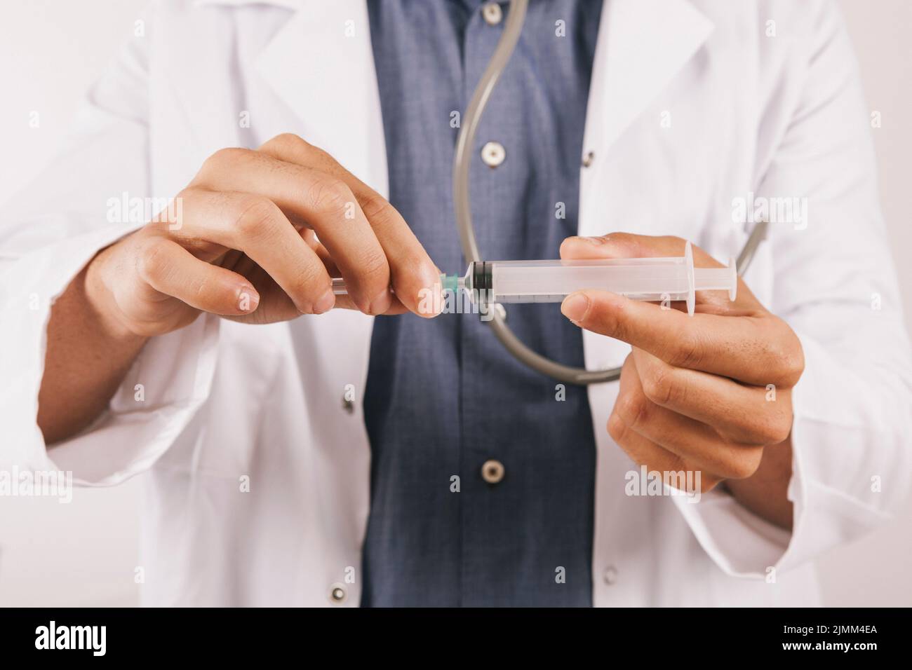 Doctor s hand holding vaccine Stock Photo - Alamy