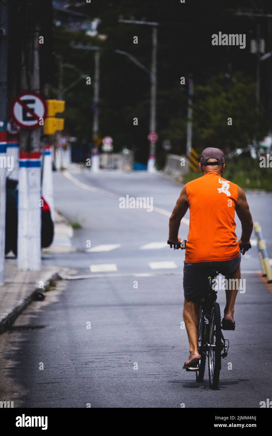 An old man riding a bicycle Stock Photo - Alamy