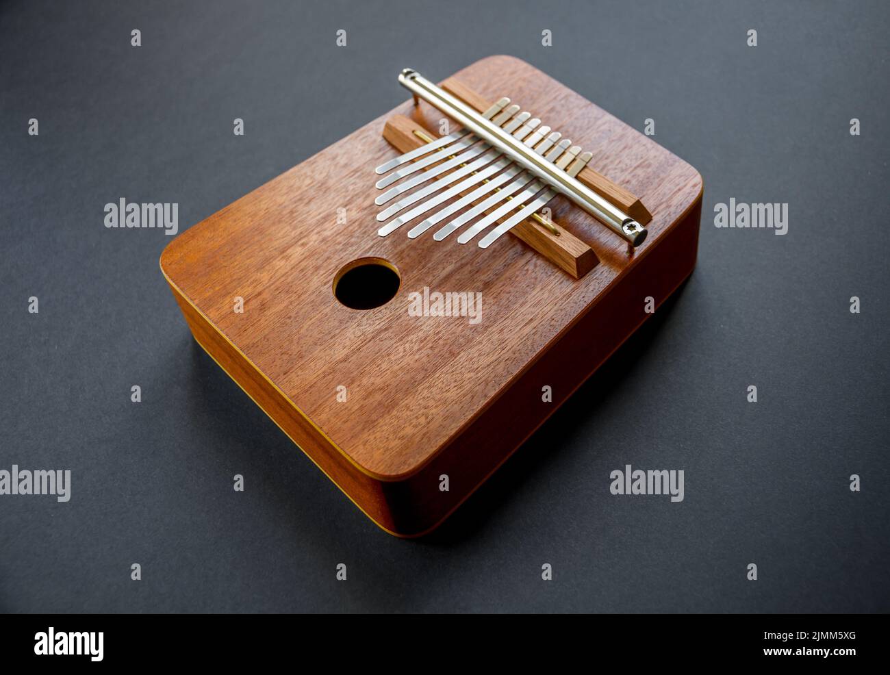 Traditional wooden kalimba isolated on black Stock Photo - Alamy