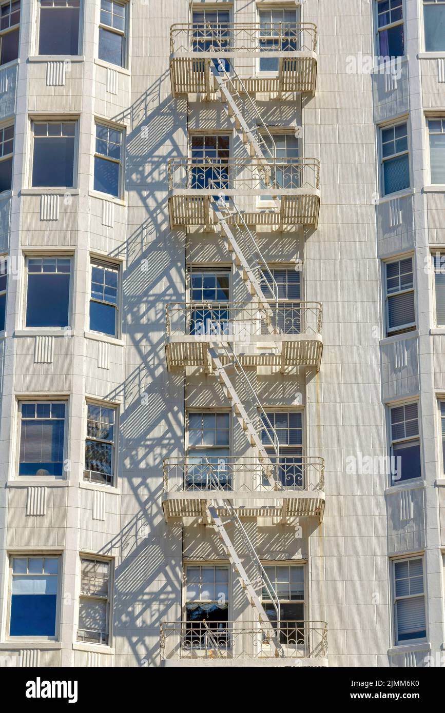 Emergency stairs in the middle of bay windows of a tall apartment ...