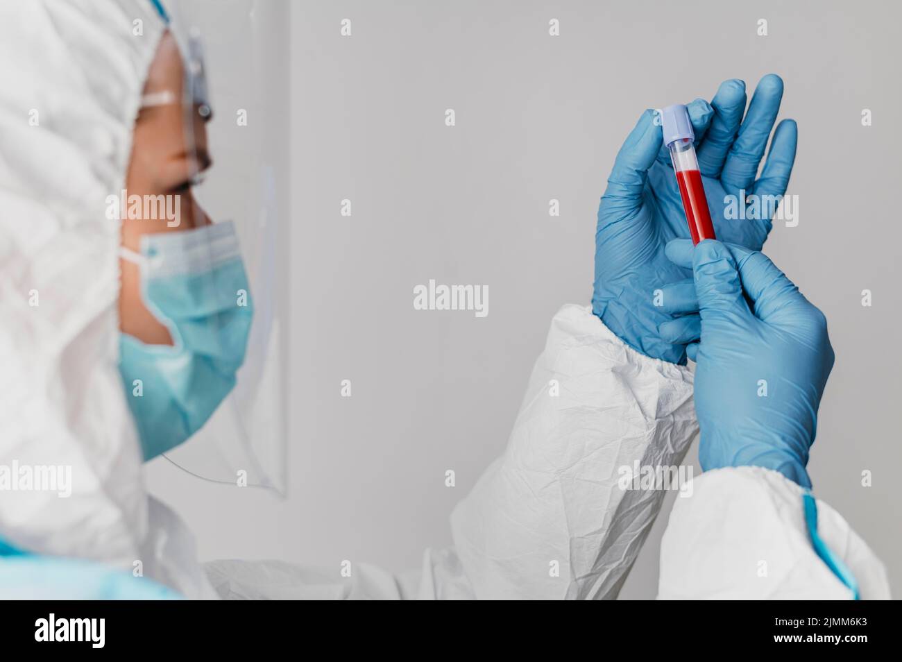 Laboratory doctor holding blood sample hi-res stock photography and ...
