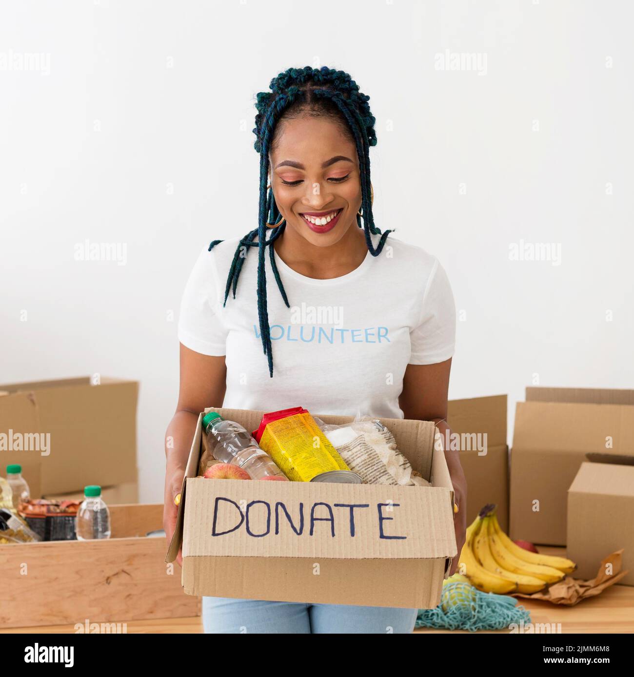 Woman carry box hi-res stock photography and images - Alamy