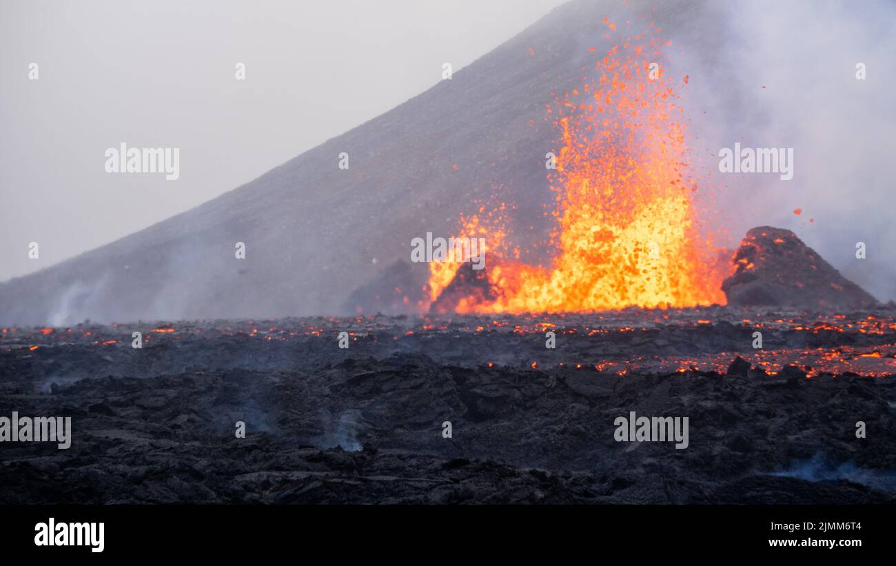 Lava spattering during a small volcanic eruption in Mt Fagradalsfjall ...