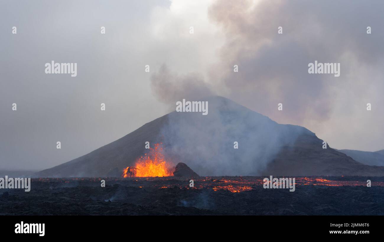 Lava spattering during a small volcanic eruption in Mt Fagradalsfjall ...