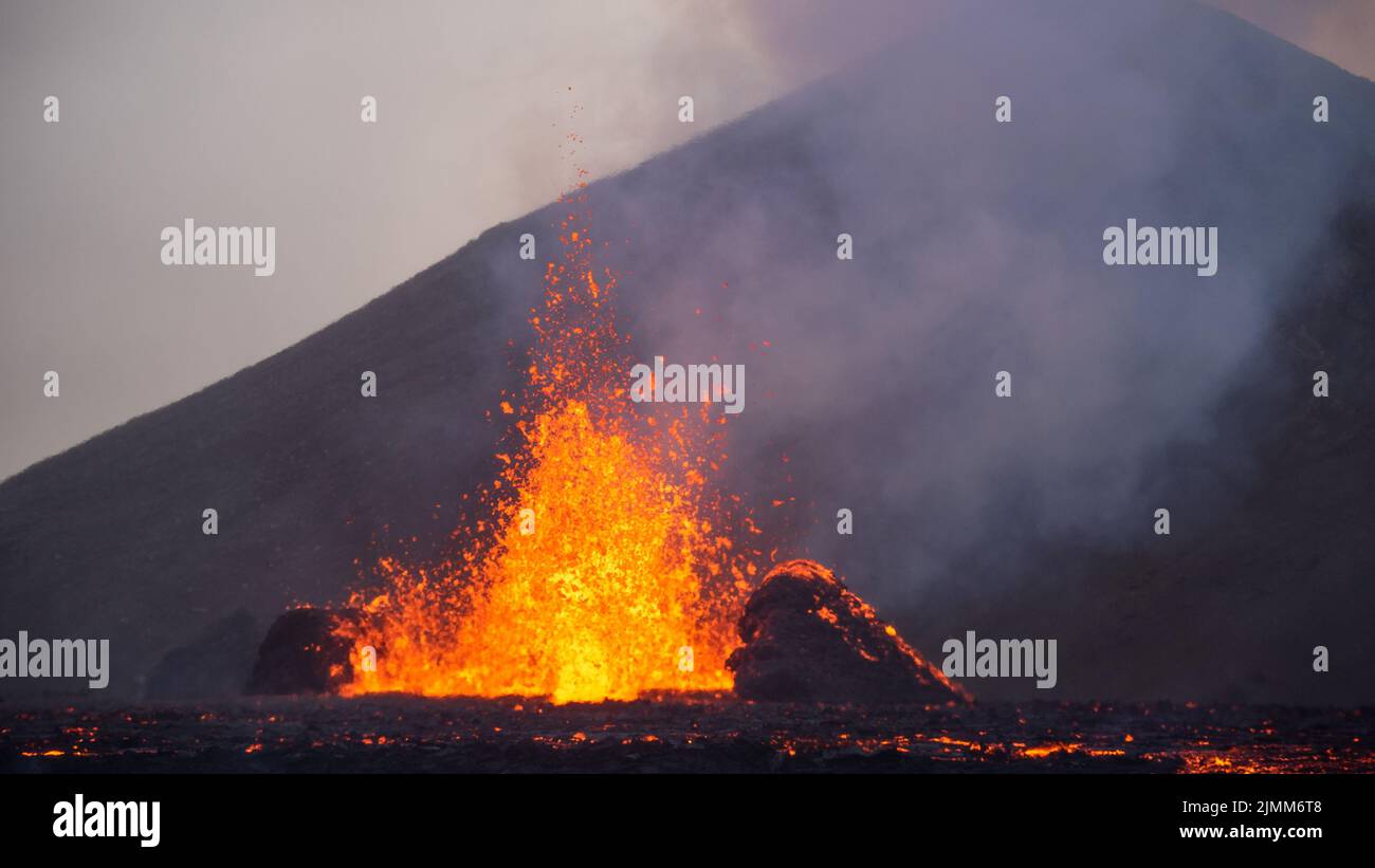 Lava spattering during a small volcanic eruption in Mt Fagradalsfjall ...