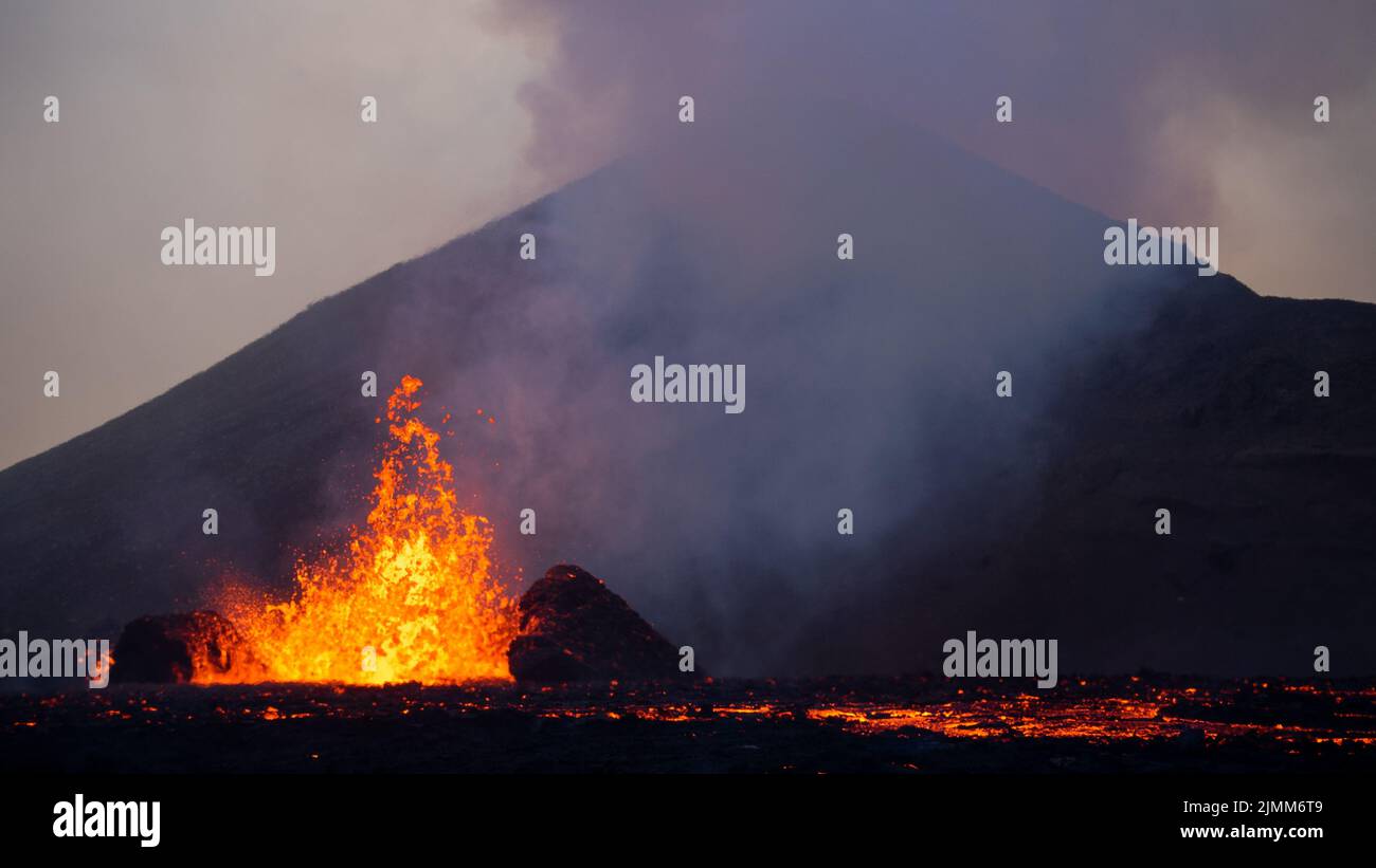 Lava spattering during a small volcanic eruption in Mt Fagradalsfjall ...