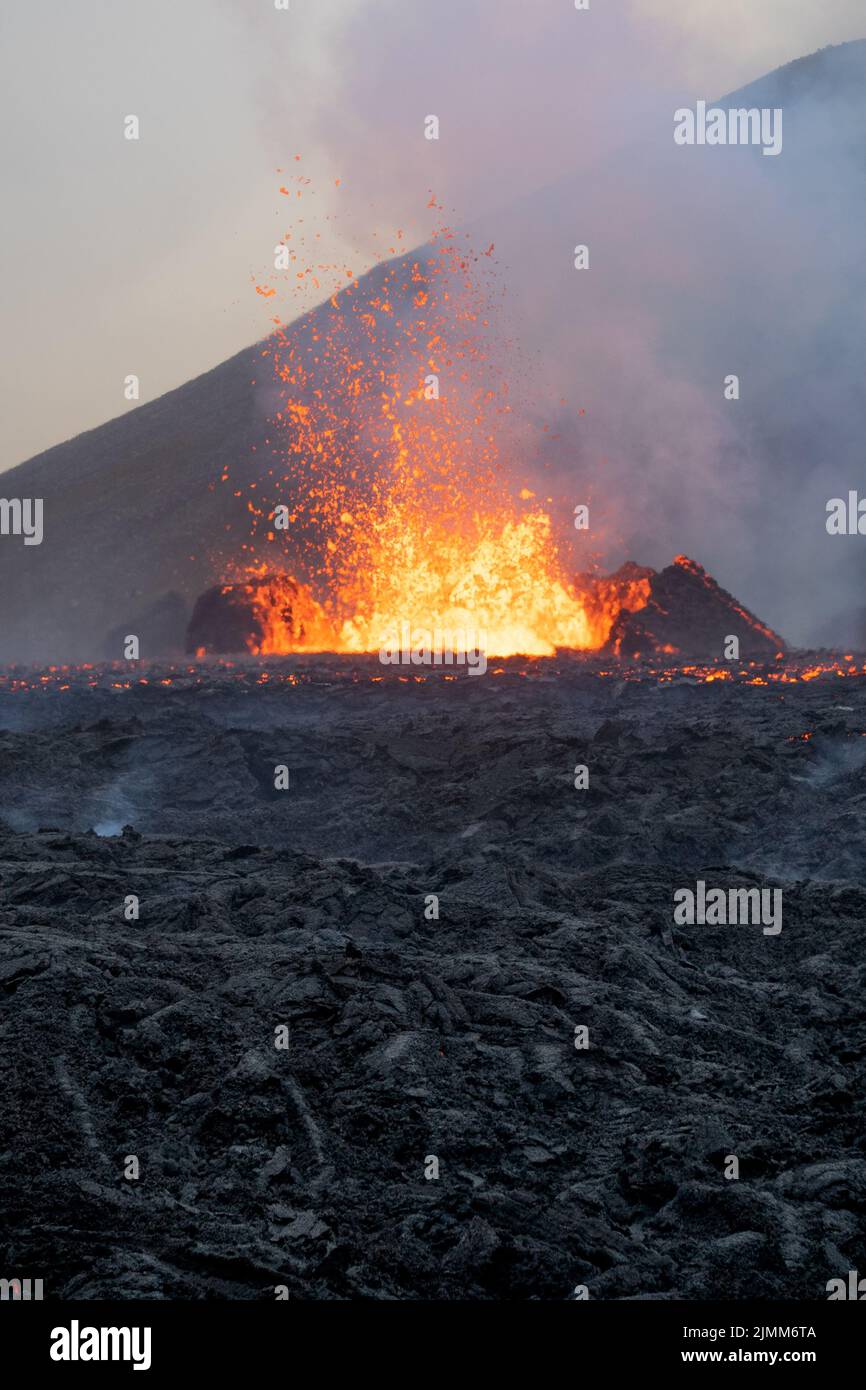 Lava spattering during a small volcanic eruption in Mt Fagradalsfjall ...