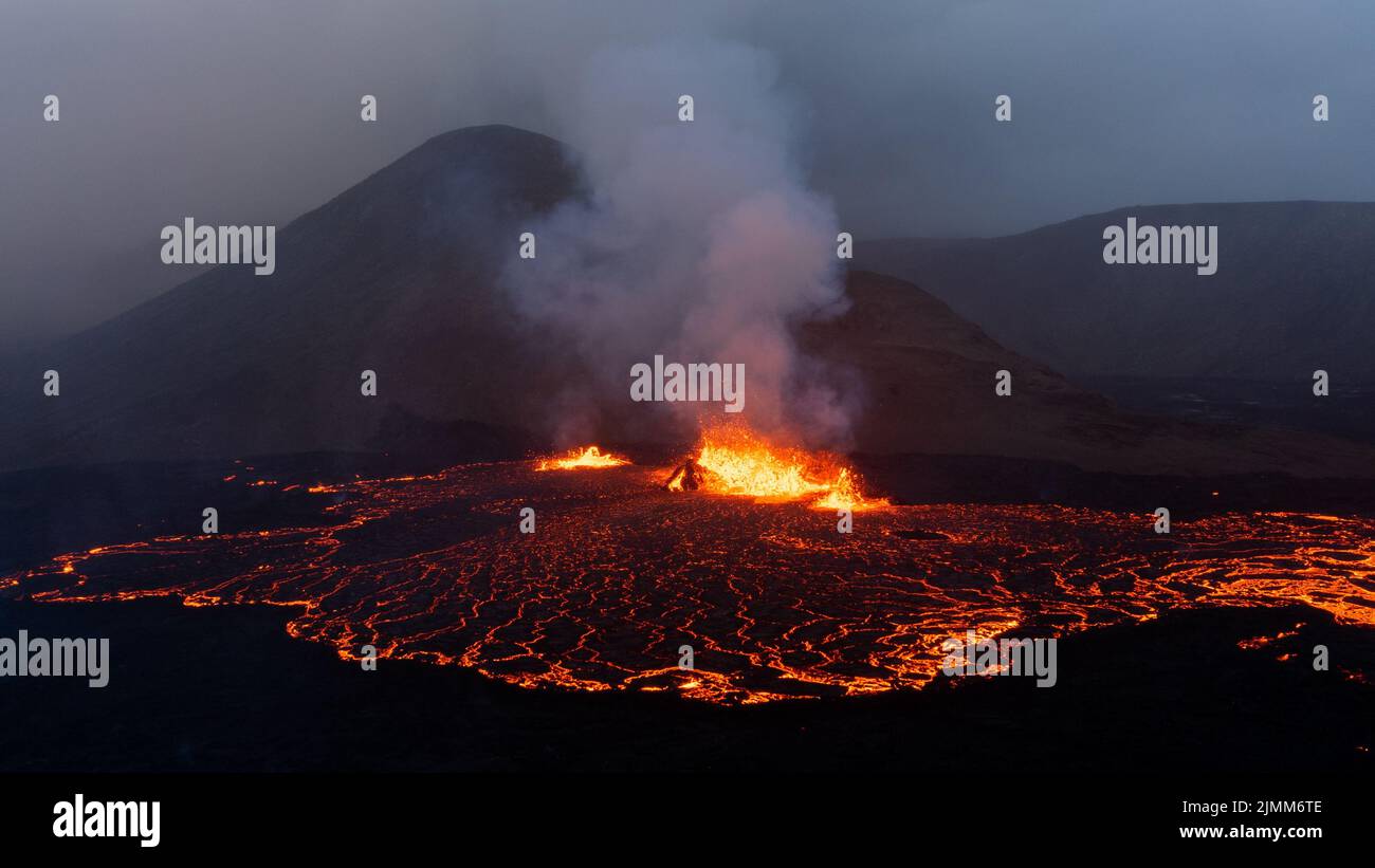 Lava spattering during a small volcanic eruption in Mt Fagradalsfjall ...