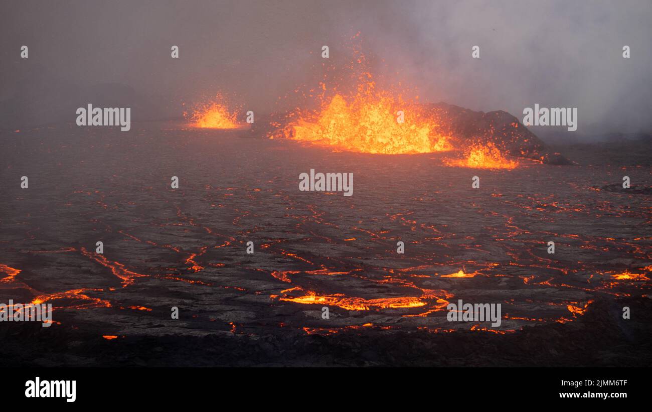 Lava spattering during a small volcanic eruption in Mt Fagradalsfjall ...