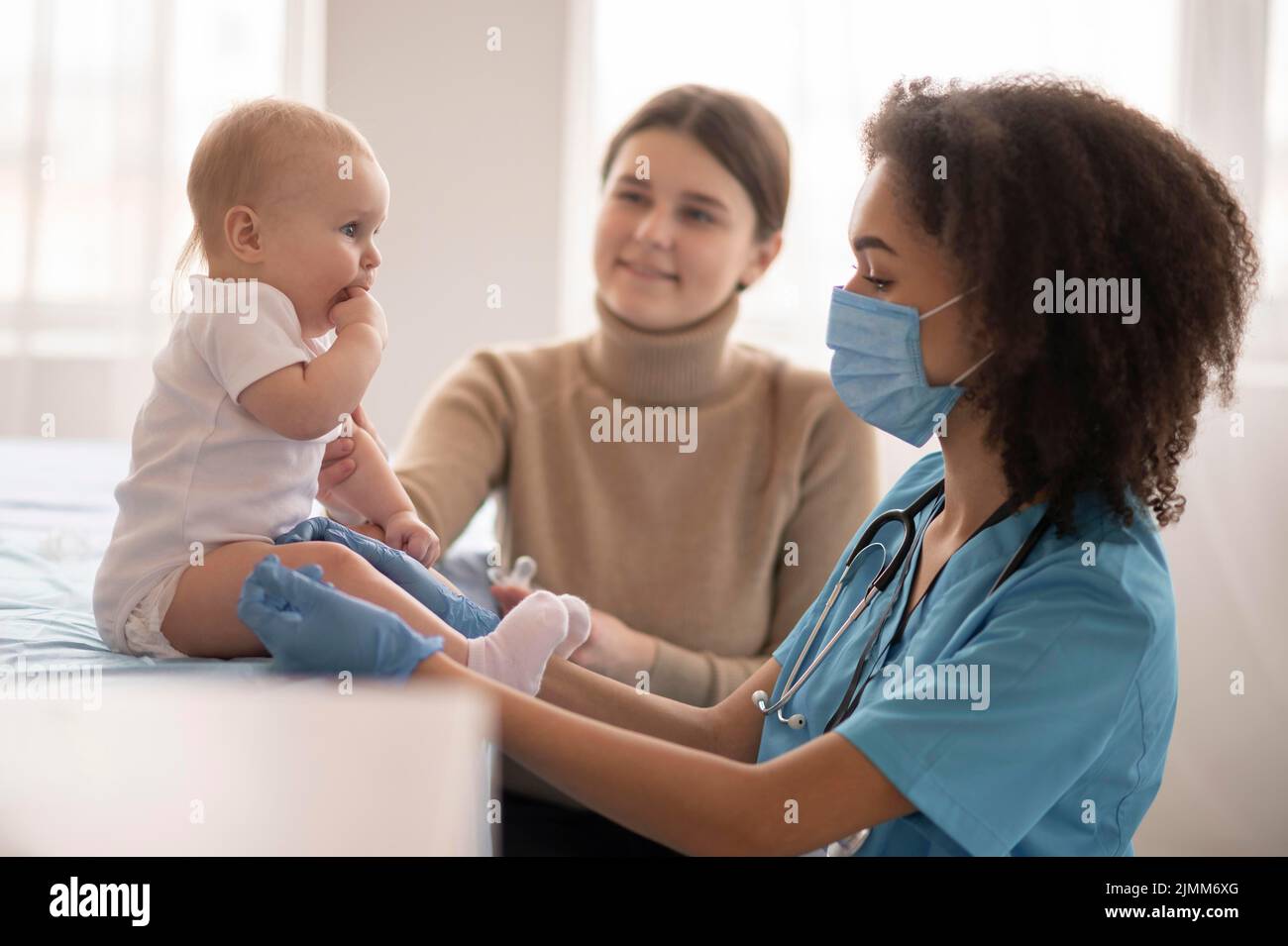 Little baby being health clinic vaccination Stock Photo - Alamy