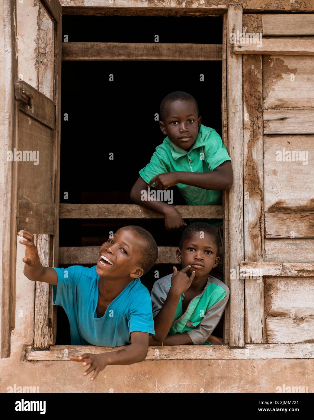 Medium shot african kids window Stock Photo - Alamy