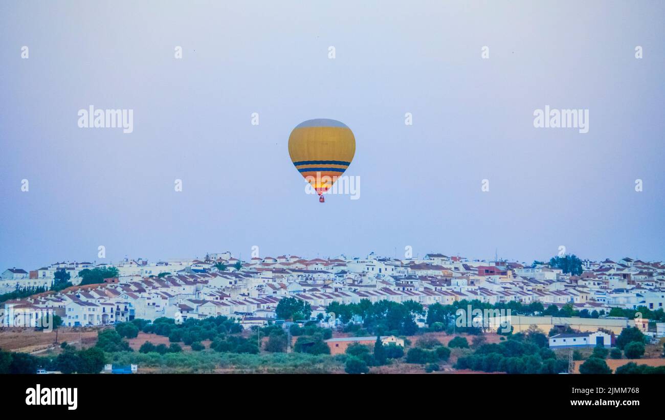 A large hot air balloon flying over Arcos de la Frontera during the ...