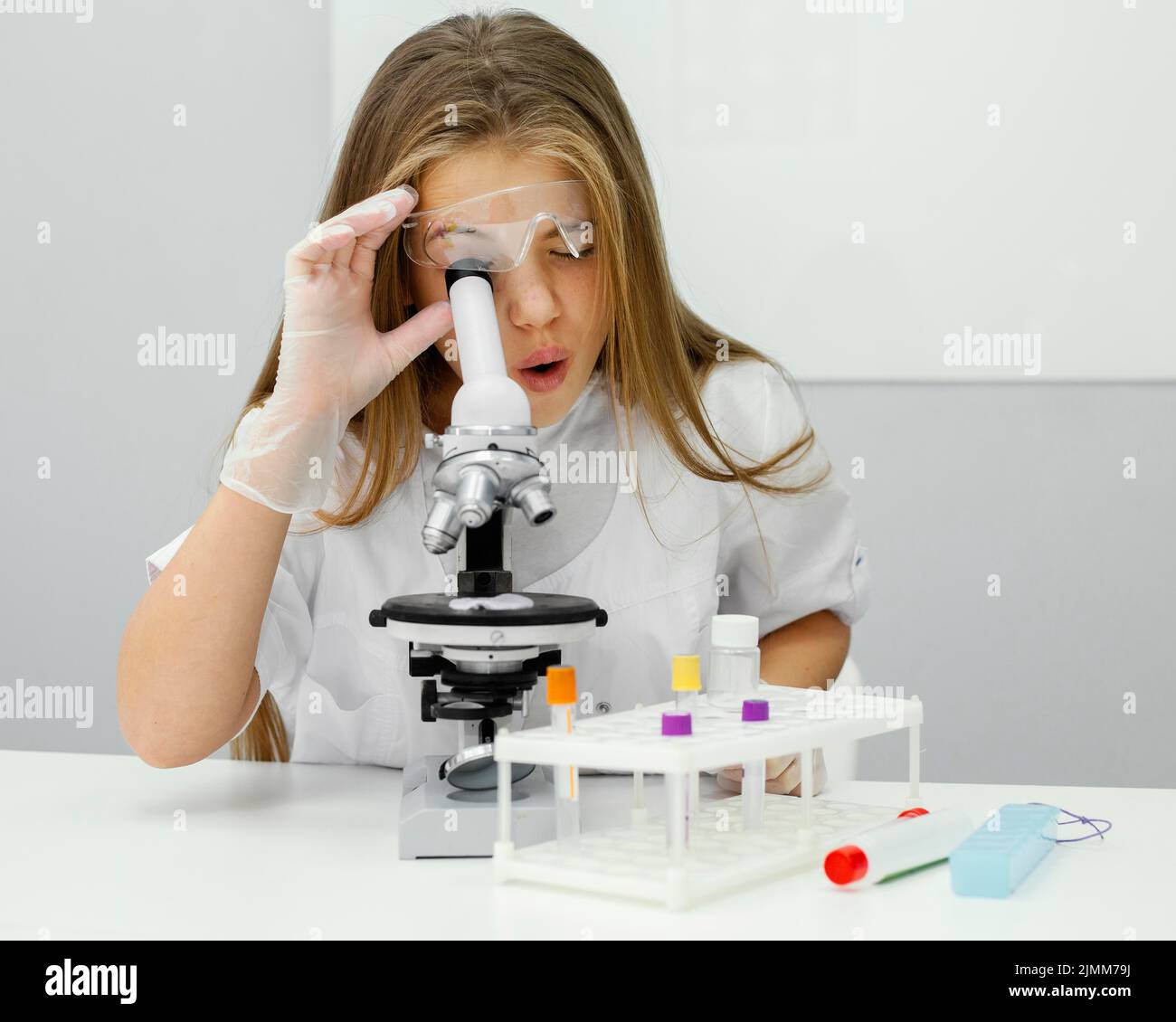 Young girl scientist using microscope Stock Photo - Alamy Young girl scientist using microscope Stock Photo - Alamy