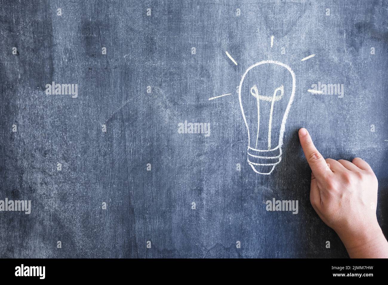 Close up person pointing finger hand drawn light bulb chalkboard Stock ...