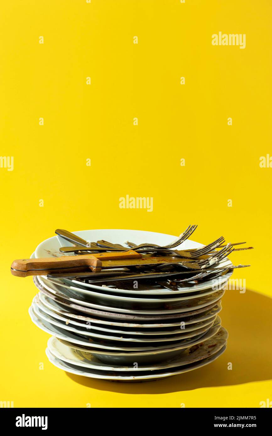 Pile dirty plates cutlery copy space Stock Photo - Alamy