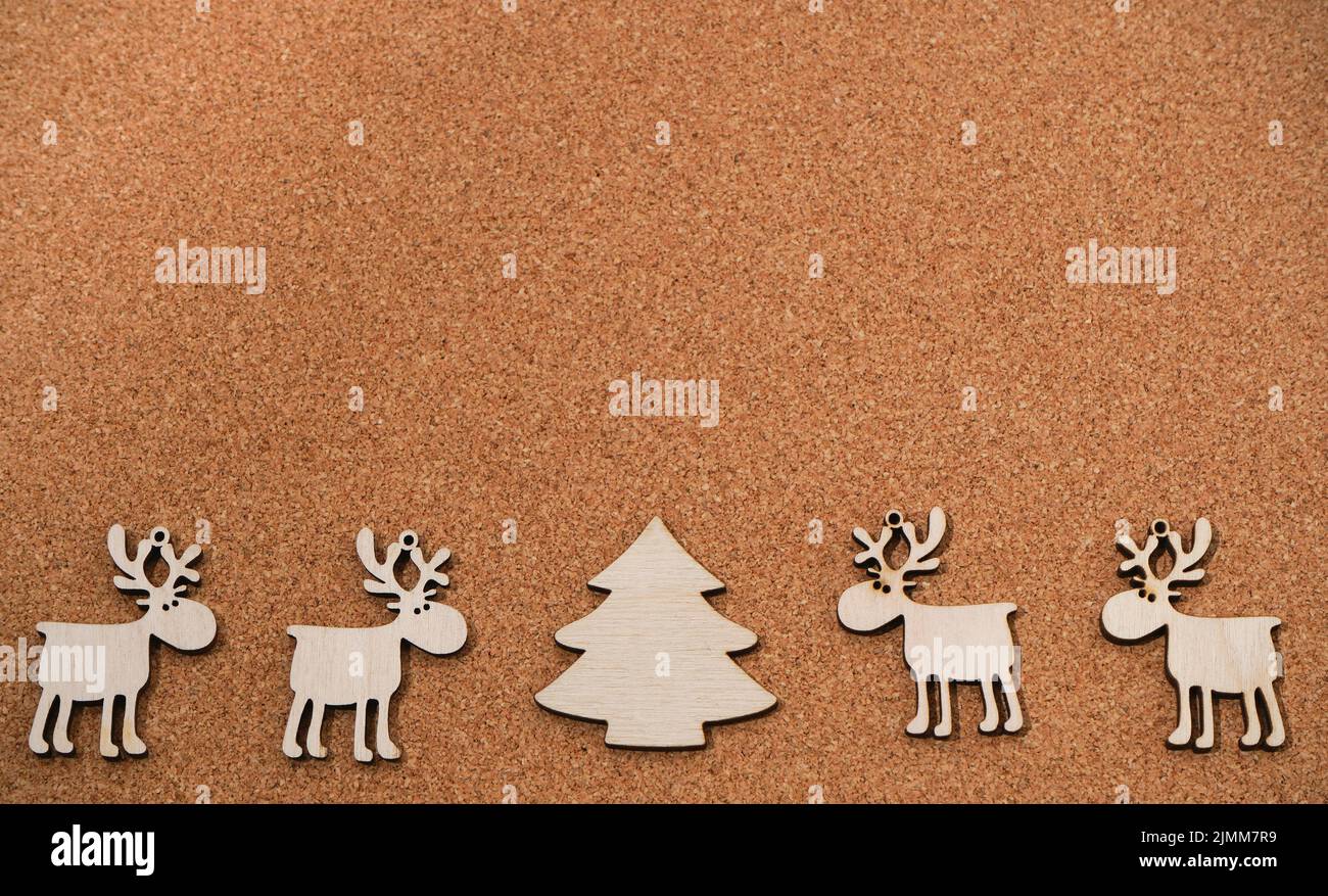 Cork background. Reindeer and Christmas tree copy space border. Place ...