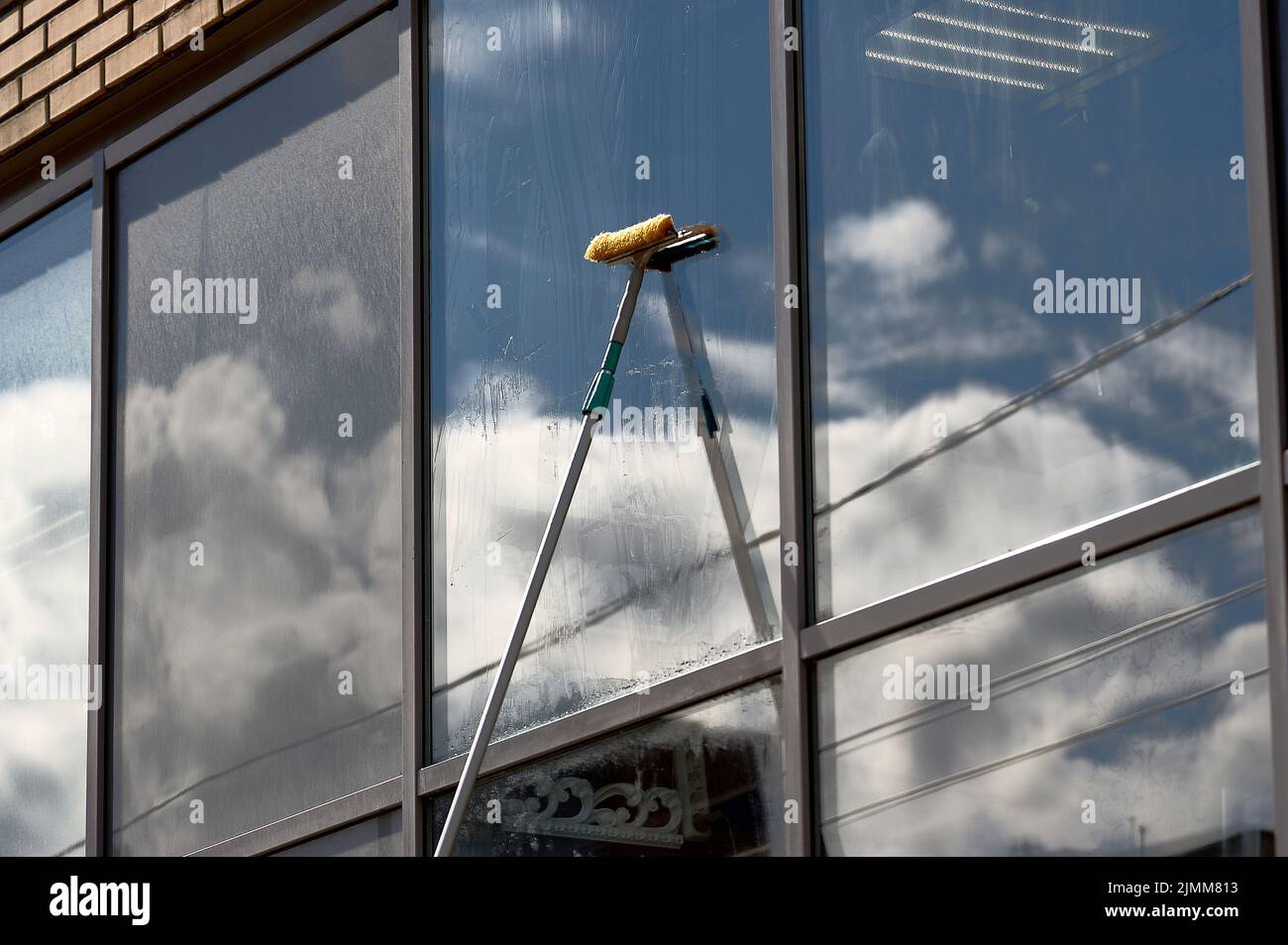 window washing, washing a street shop window Stock Photo - Alamy