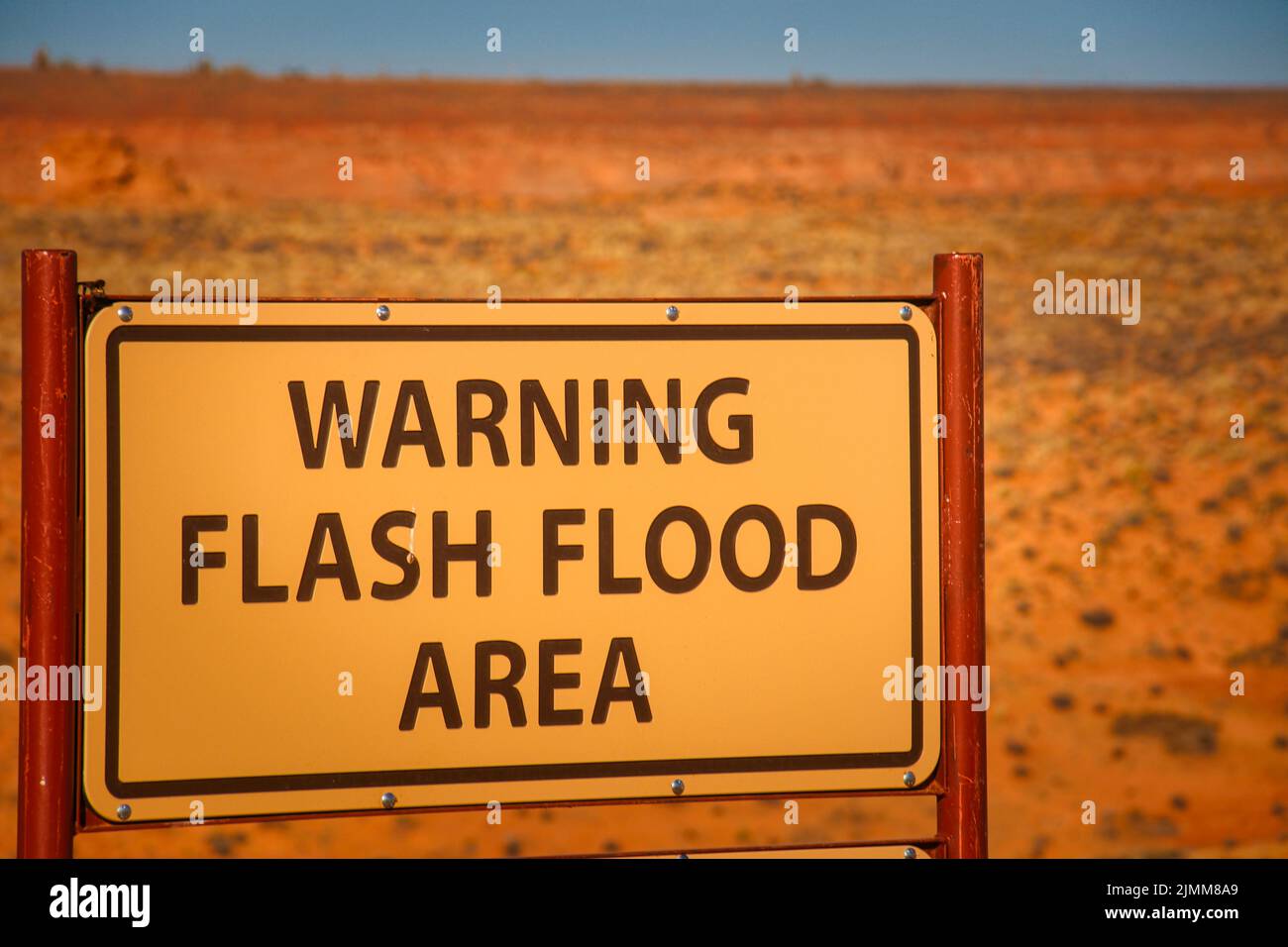 Warning sign for flash floods in a dry riverbed near Antelope Canyon in ...