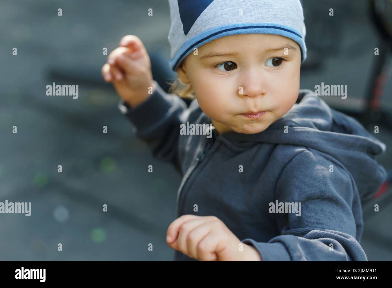 Cute little boy in a city park Stock Photo - Alamy