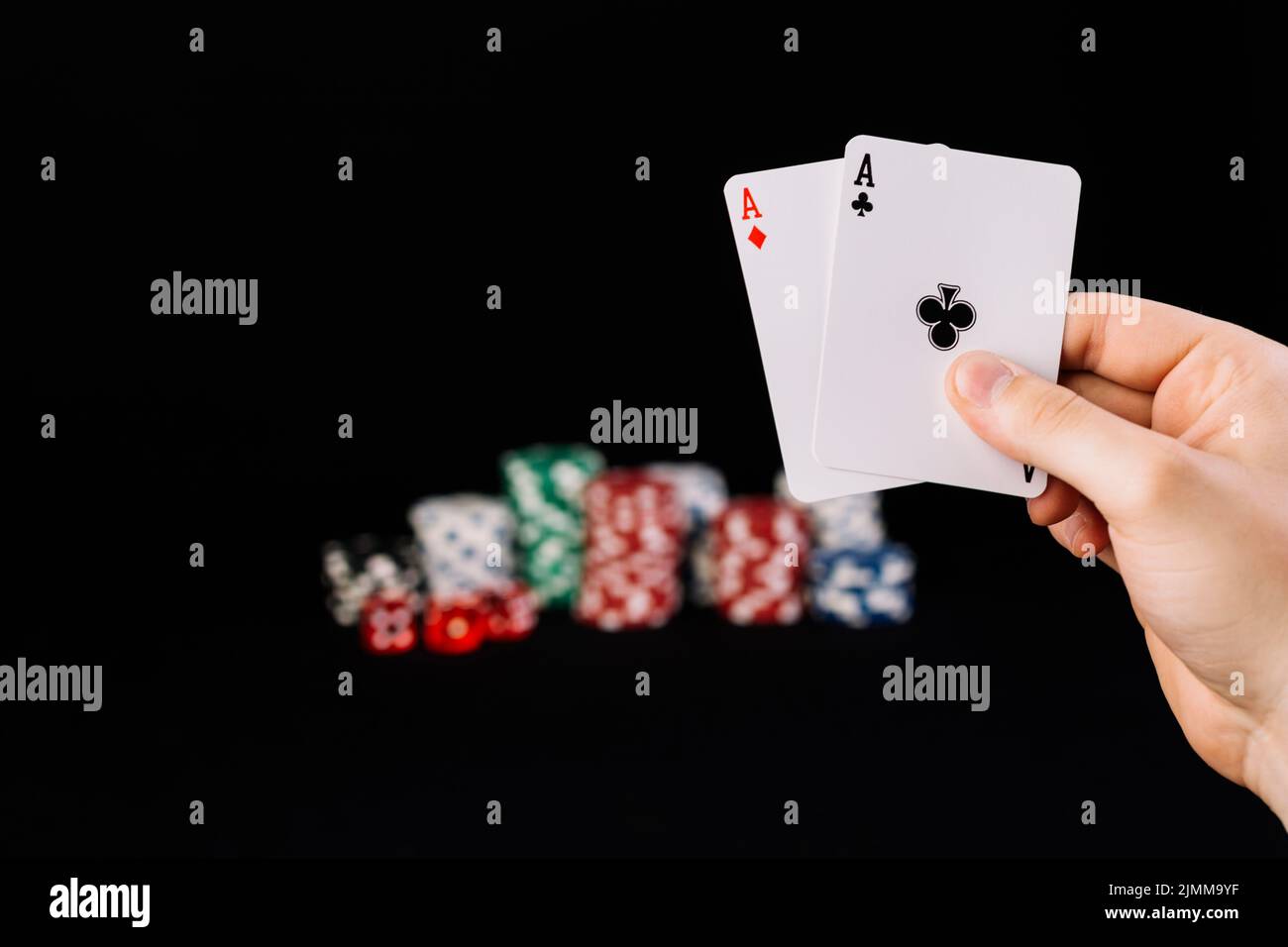 Human hand holding two aces playing cards Stock Photo - Alamy