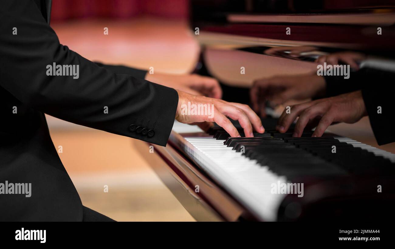 Man having classical piano recital Stock Photo - Alamy