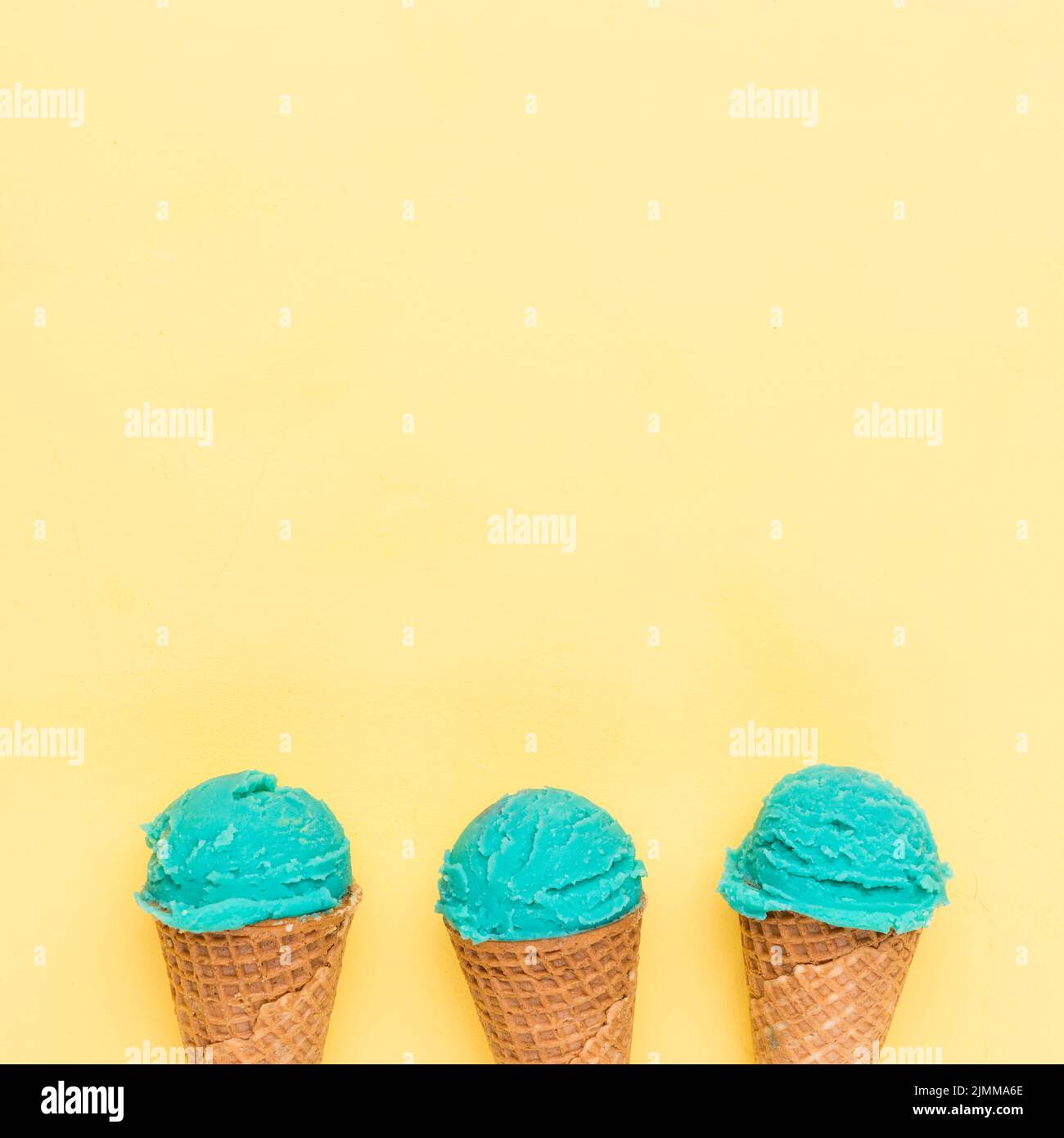 Sugar cornets with turquoise ice cream Stock Photo - Alamy