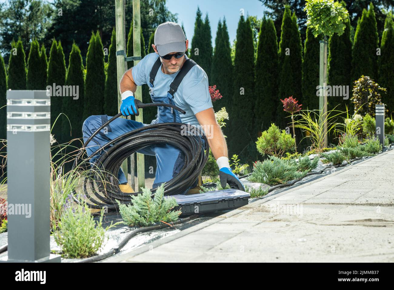 Professional Landscaping Worker in His 40s Preparing Irrigation Plastic ...