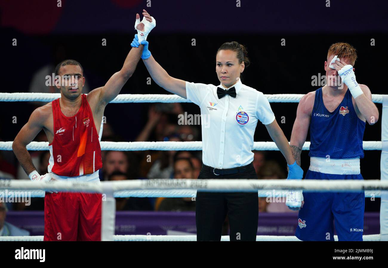 India's Amit Panghal (Red) is declared the winner and wins gold against ...