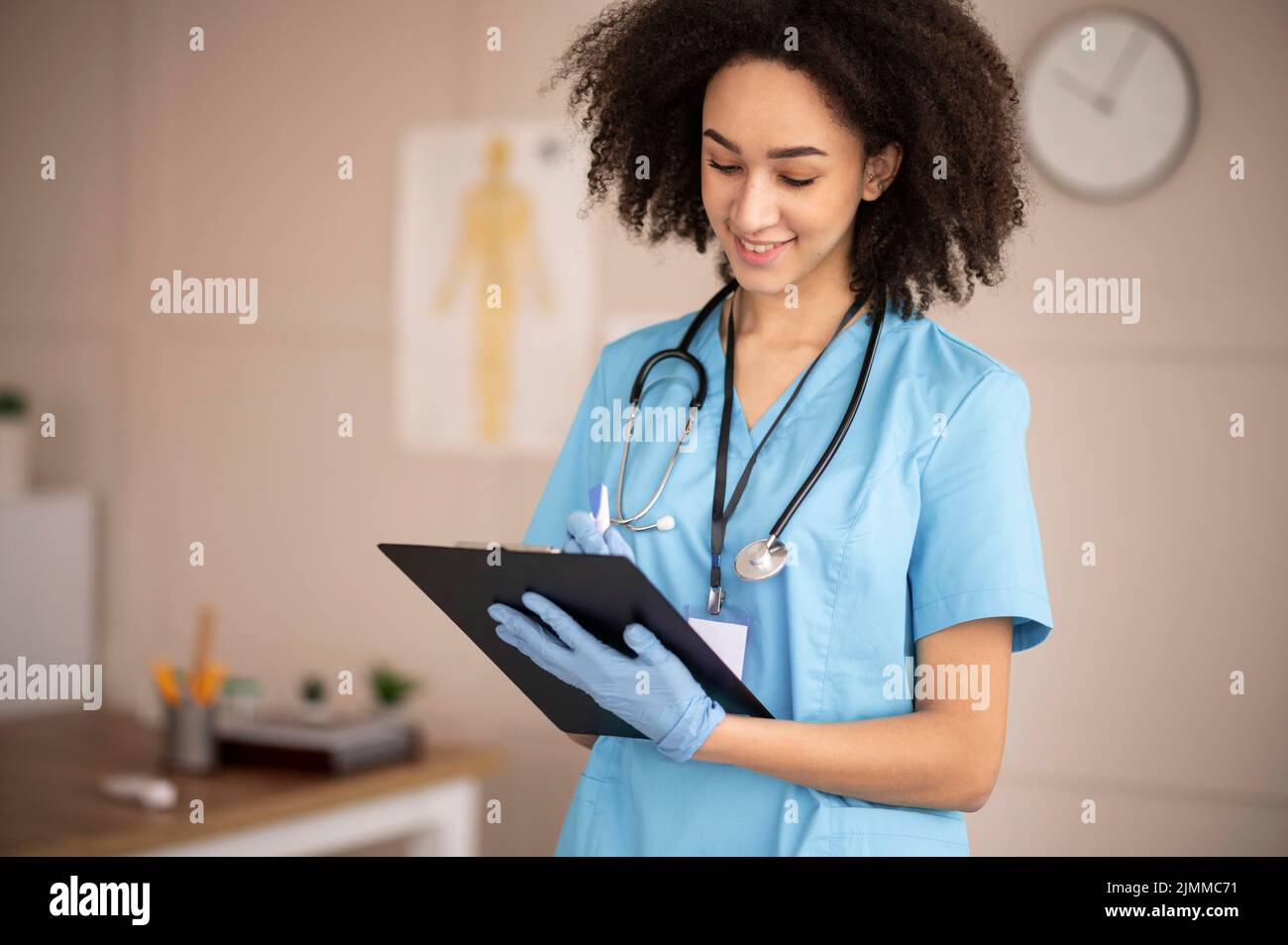 Healthcare worker writing patient notes hi-res stock photography and ...