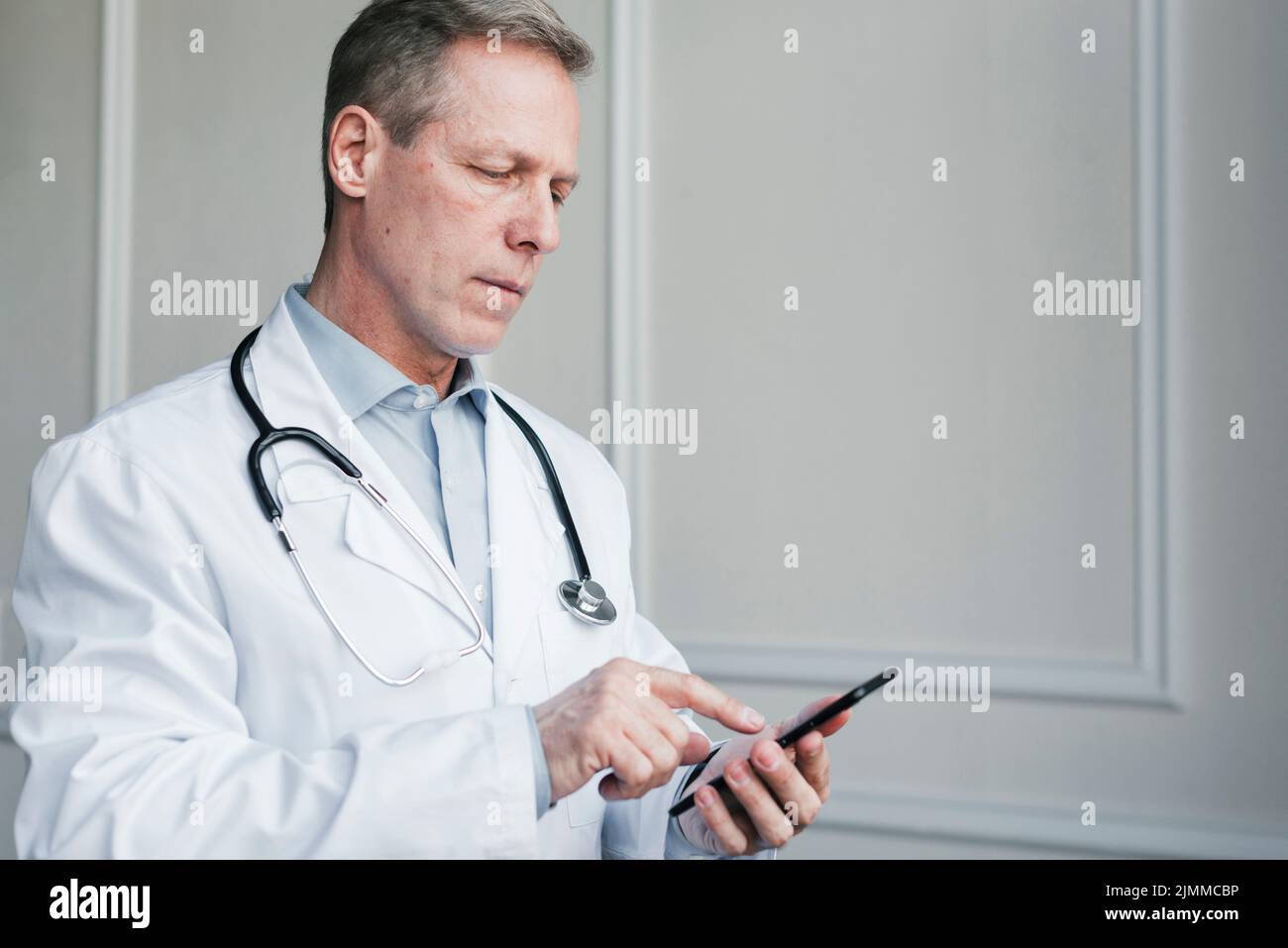 Doctor making phone call Stock Photo - Alamy