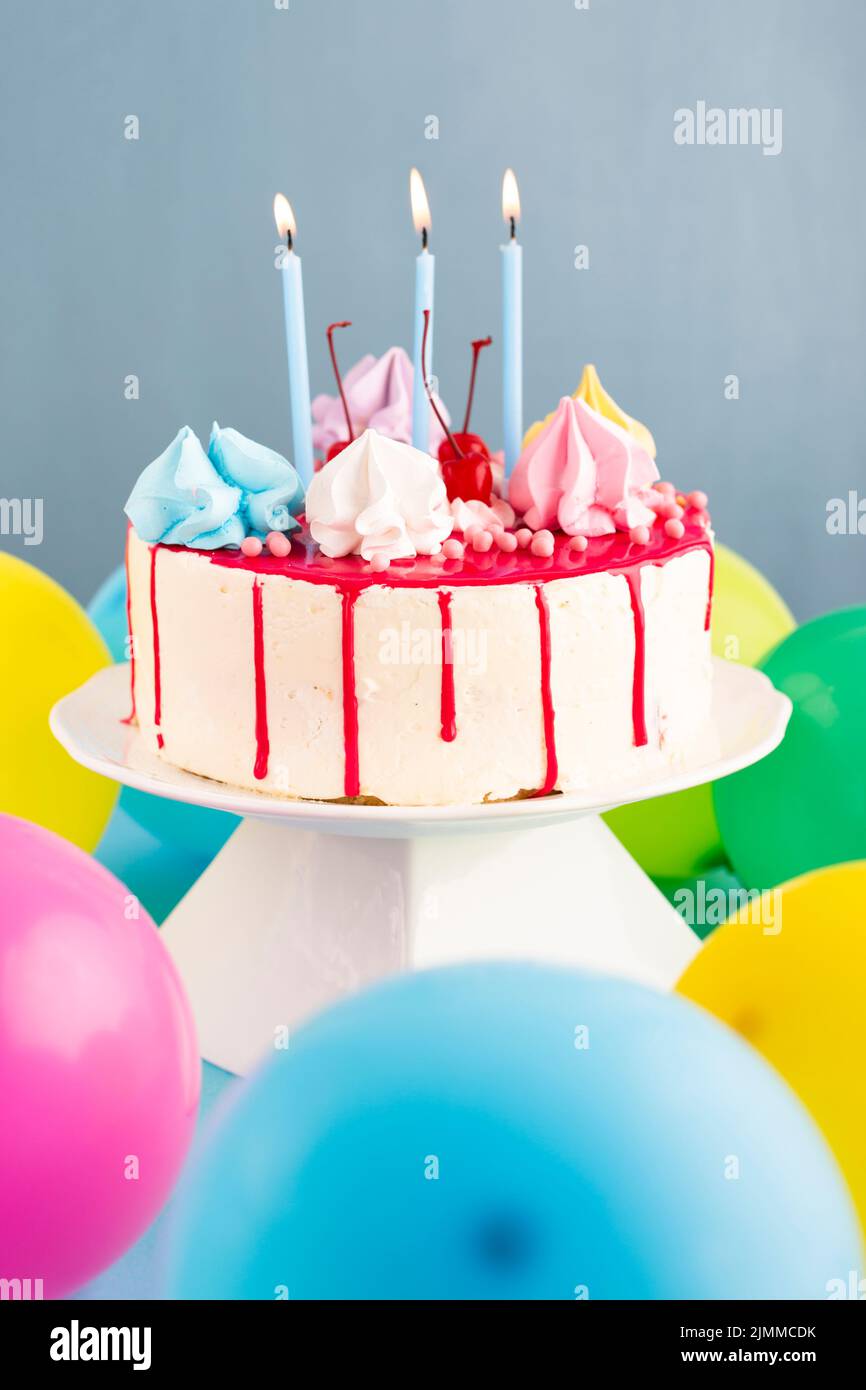 Cake with candles balloons Stock Photo - Alamy