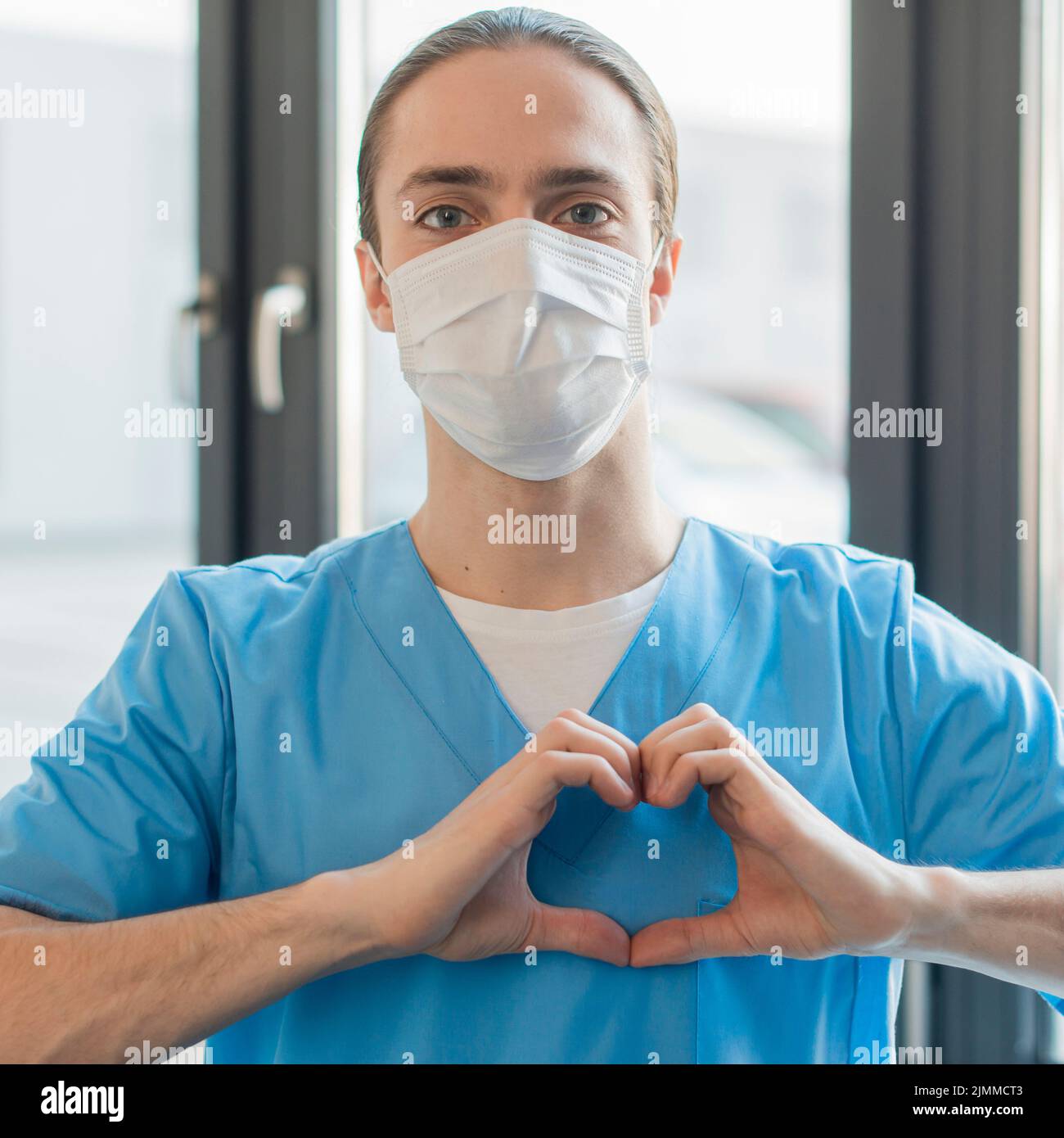 Man mask holding heart shape hi-res stock photography and images - Alamy