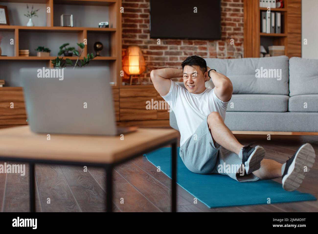 Sport and healthy lifestyle. Active mature man doing exercises for ...