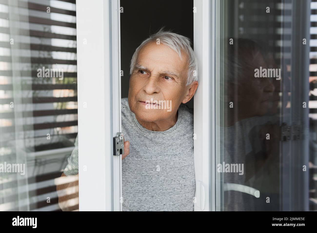 Elderly looking window hi-res stock photography and images - Alamy