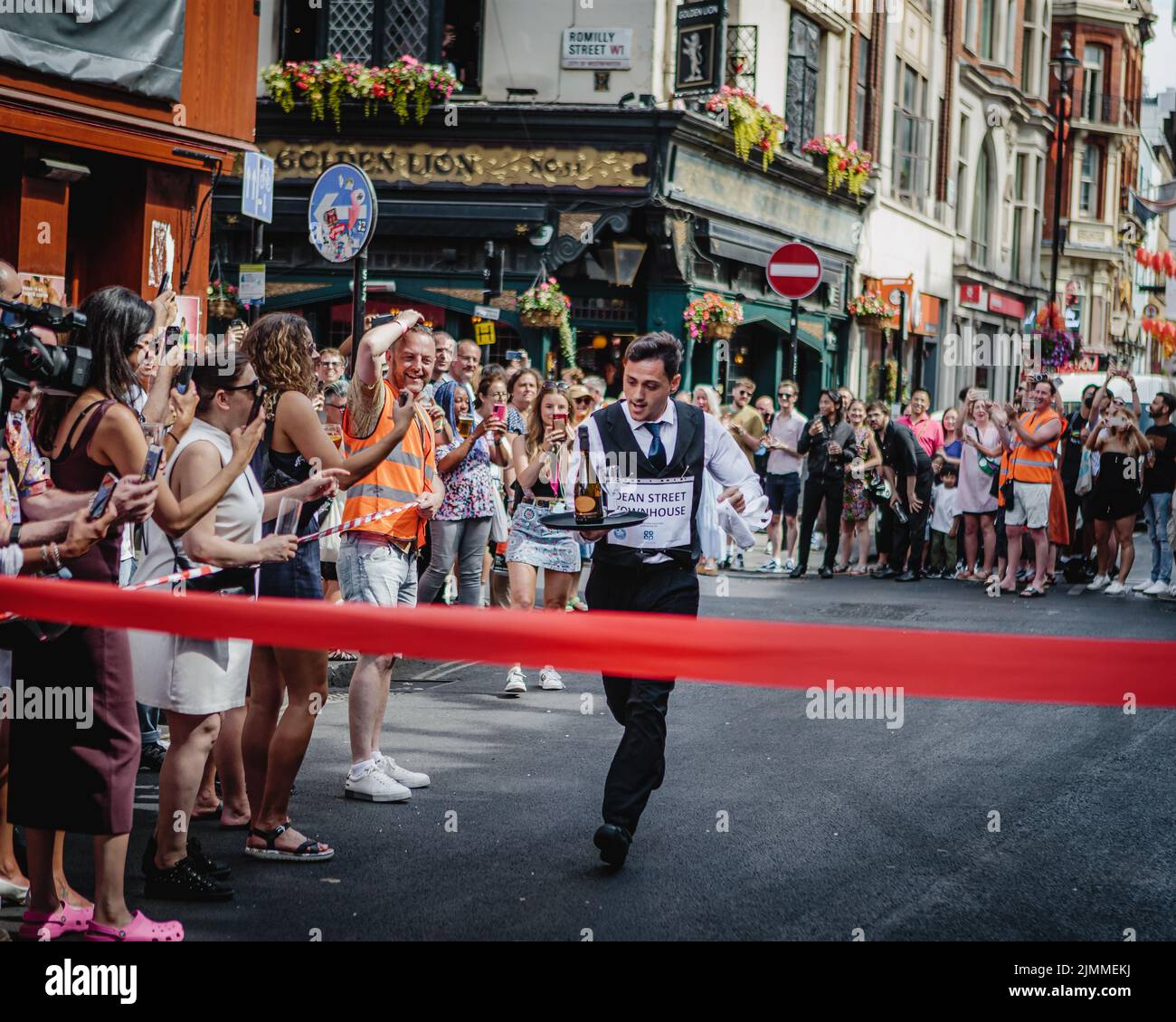 The winner of the Soho Waiters’ Race approaches the finish line. An ...
