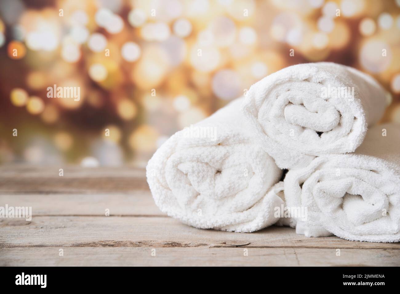 Front view stacked towels with bokeh background Stock Photo - Alamy
